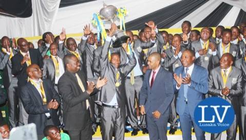 ZESCO captain- Jacob Banda lifting the trophy – Image Credit – Jean ...